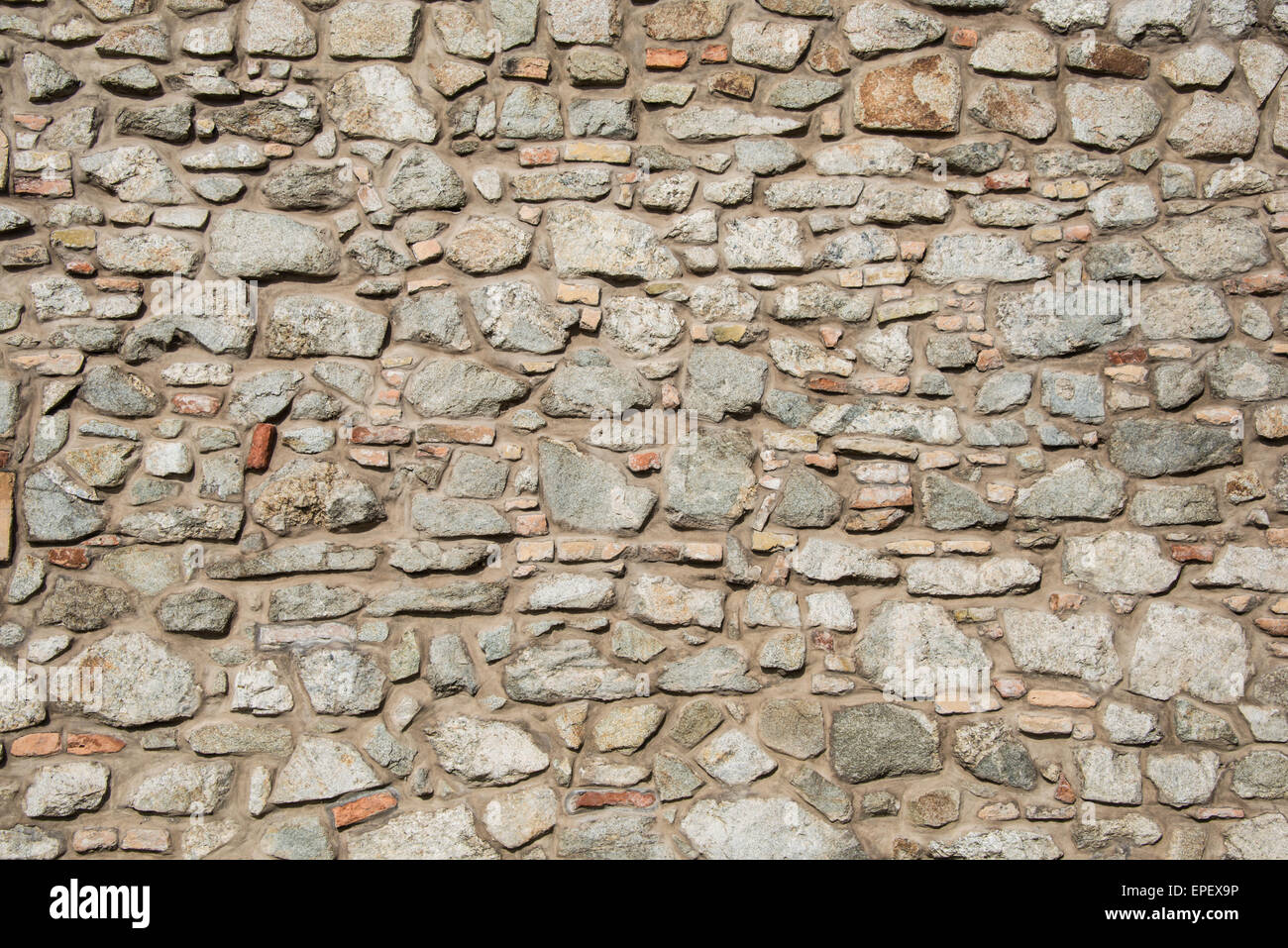 Wall made of various stones Stock Photo - Alamy