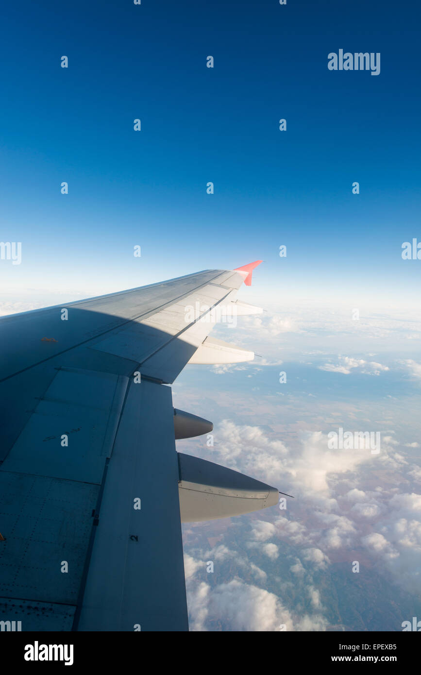 Airplane wing out of window Stock Photo - Alamy
