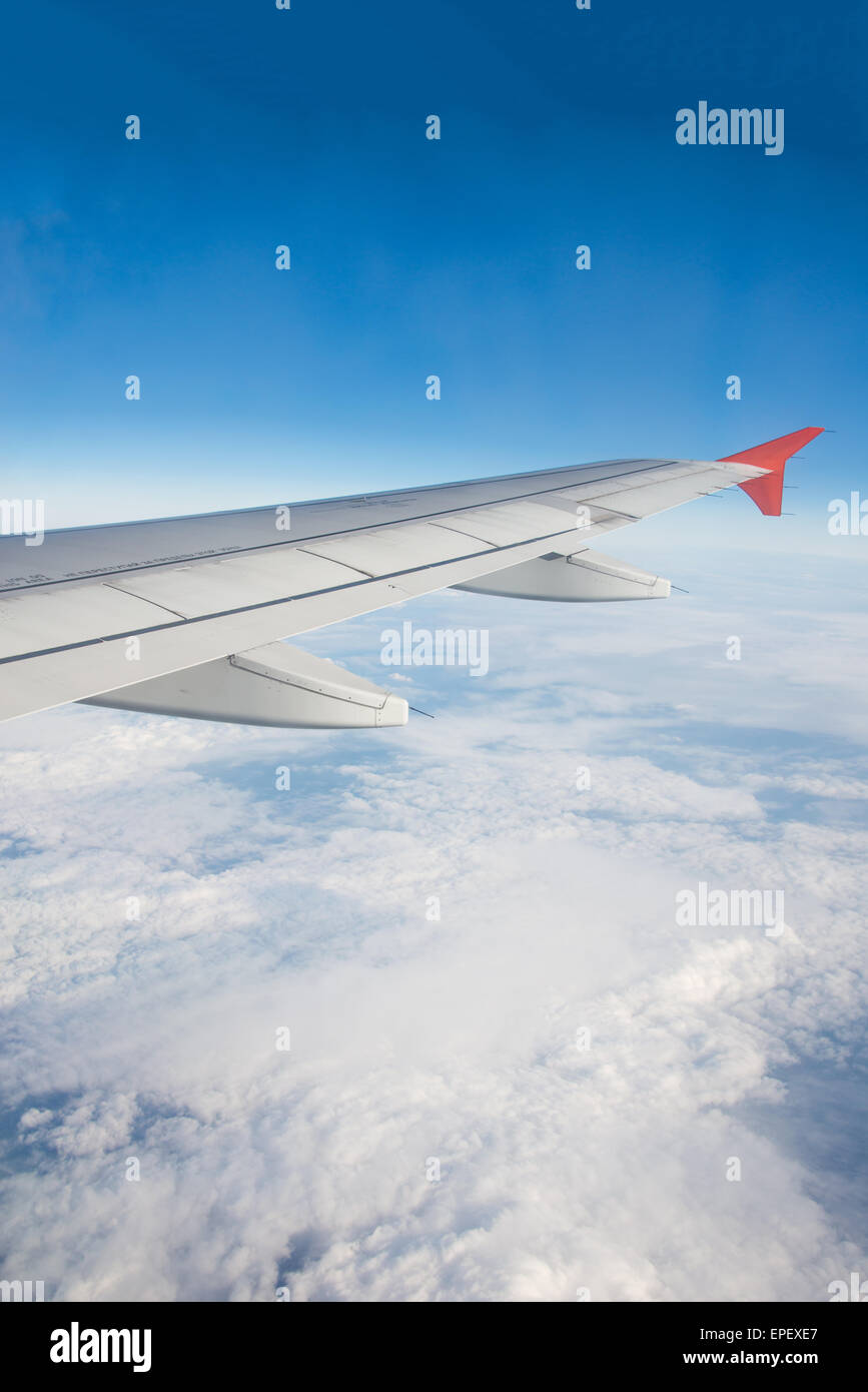 Airplane wing out of window Stock Photo - Alamy