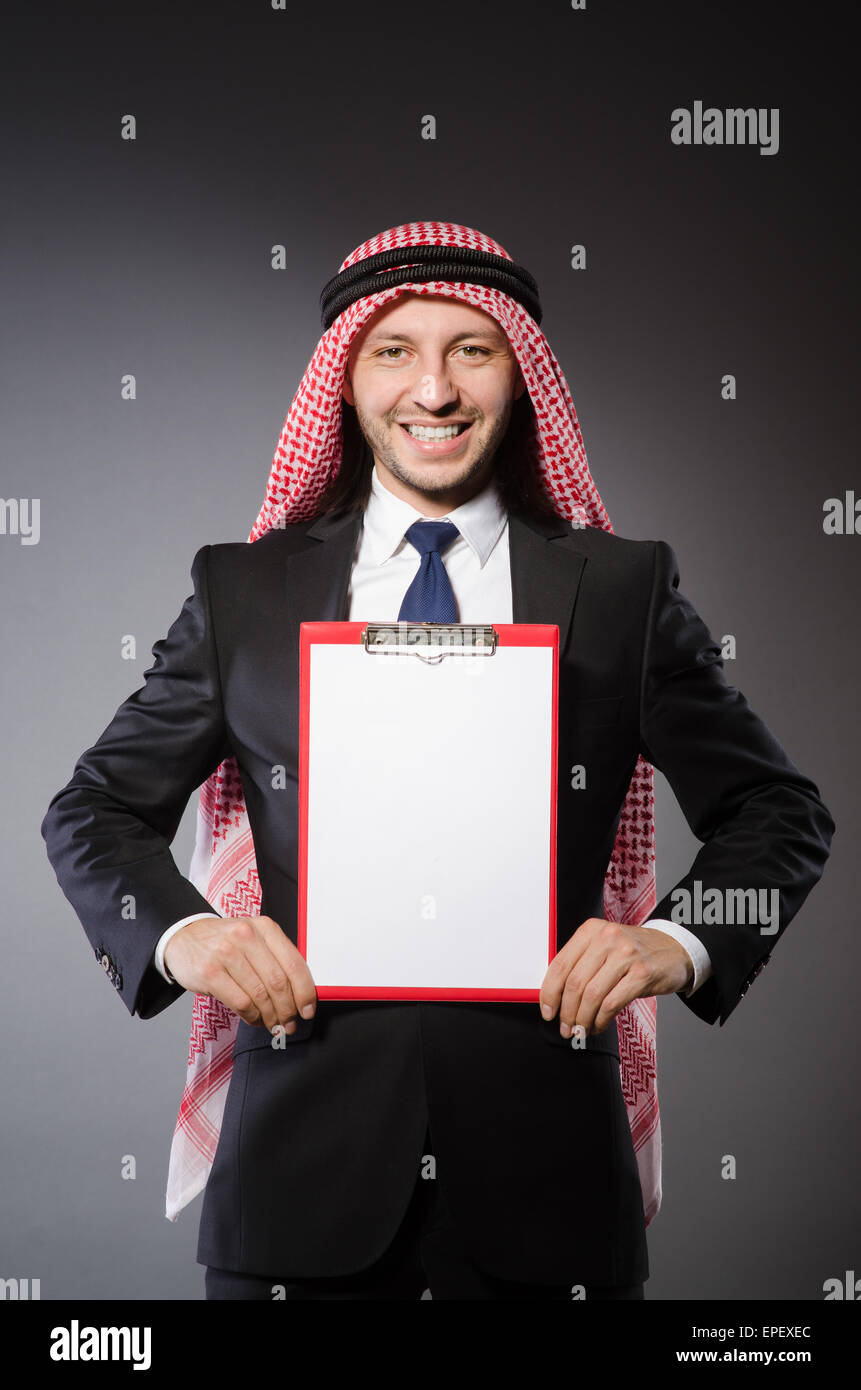Arab man with paper binder Stock Photo - Alamy