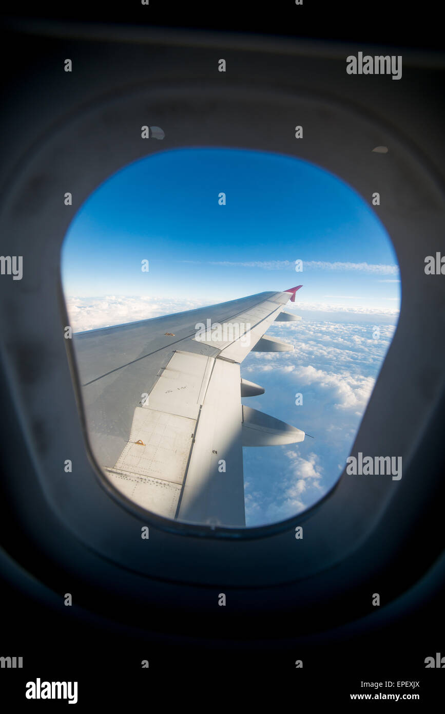 Airplane wing out of window Stock Photo - Alamy