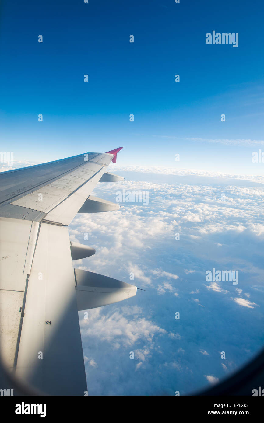 Airplane wing out of window Stock Photo - Alamy