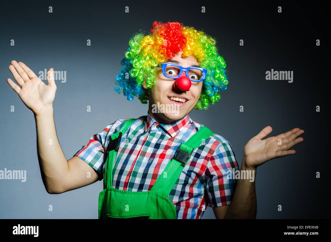 Funny clown against the dark background Stock Photo - Alamy