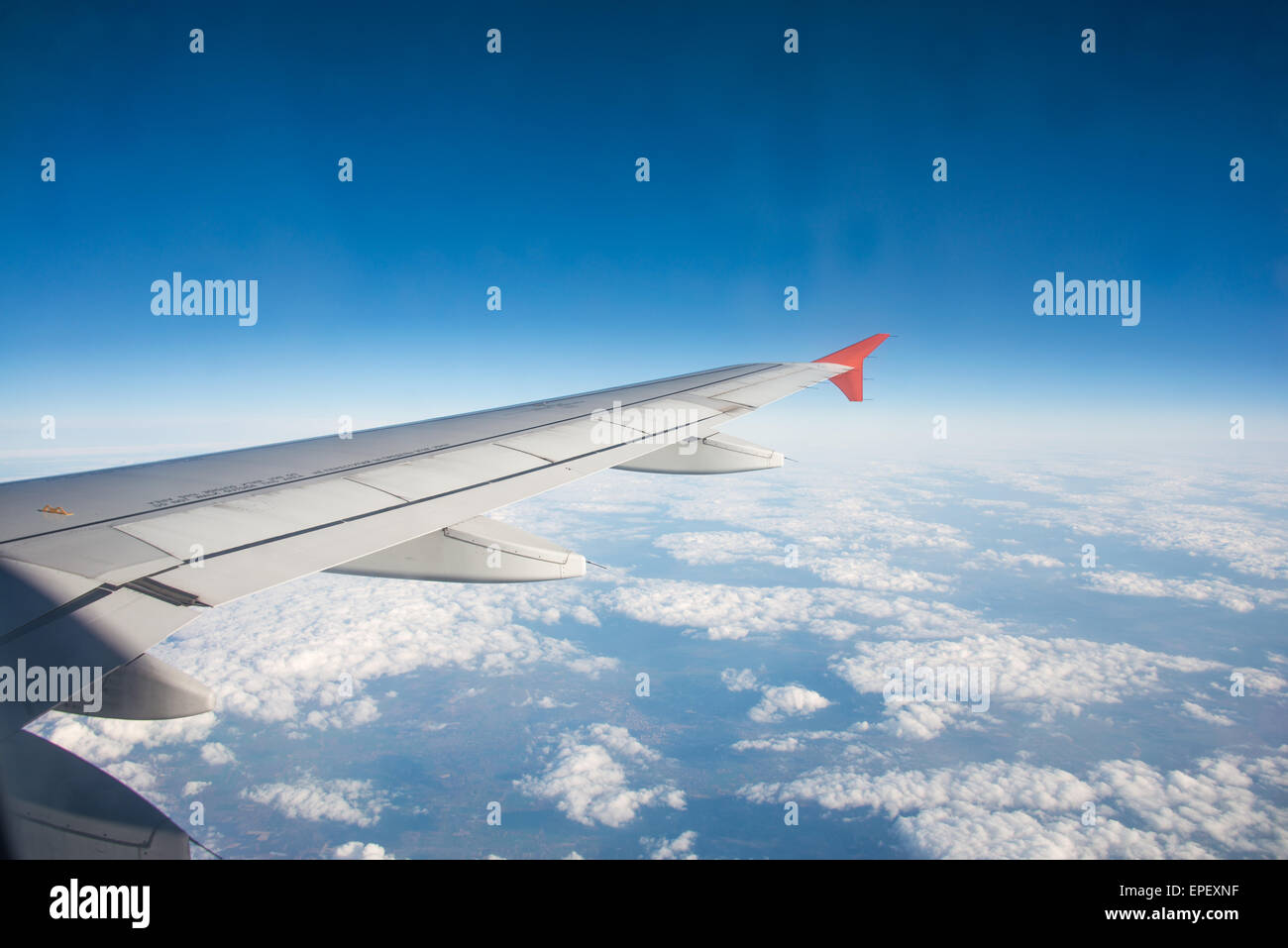 Airplane wing out of window Stock Photo - Alamy