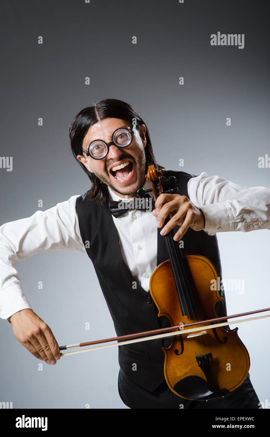 Funny fiddle violin player in musical concept Stock Photo - Alamy