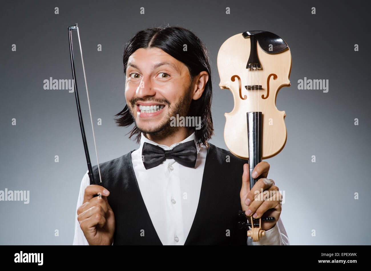 Funny fiddle violin player in musical concept Stock Photo - Alamy