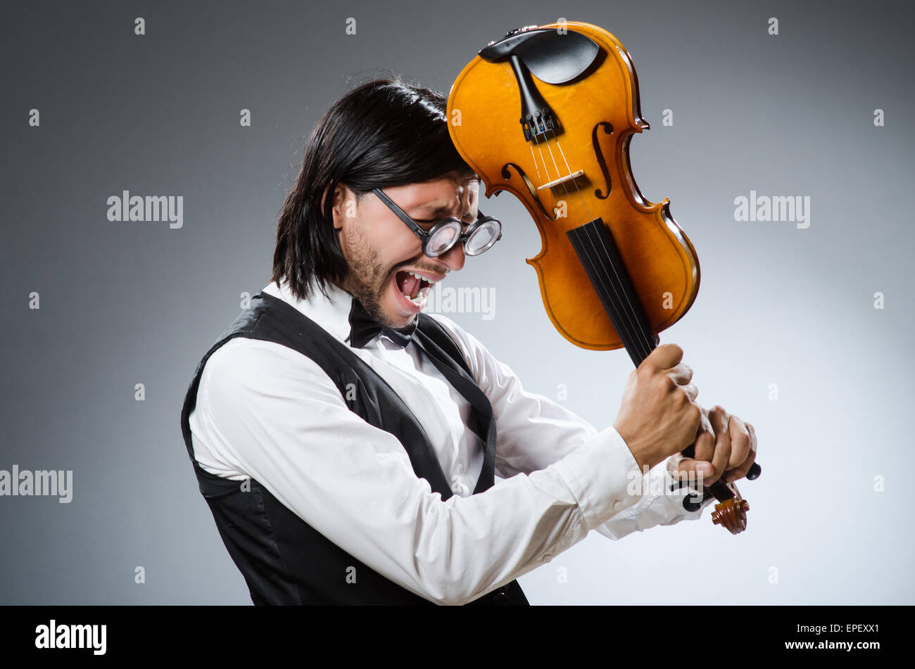 Funny fiddle violin player in musical concept Stock Photo - Alamy