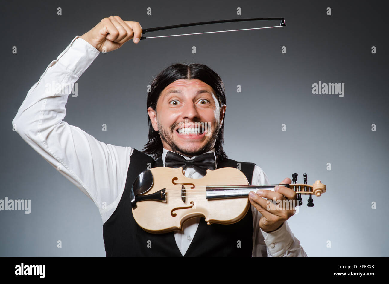 Funny fiddle violin player in musical concept Stock Photo - Alamy
