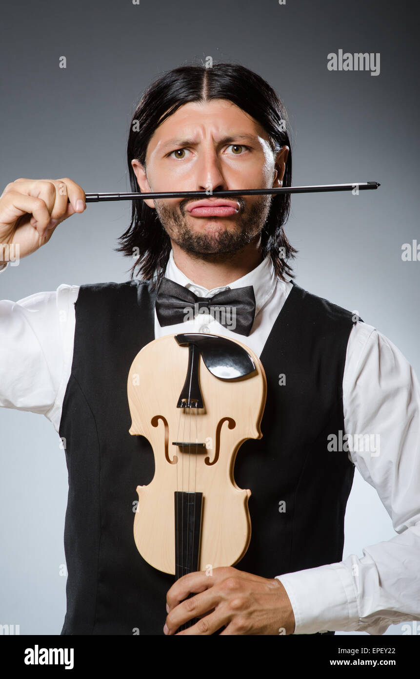 Funny fiddle violin player in musical concept Stock Photo - Alamy