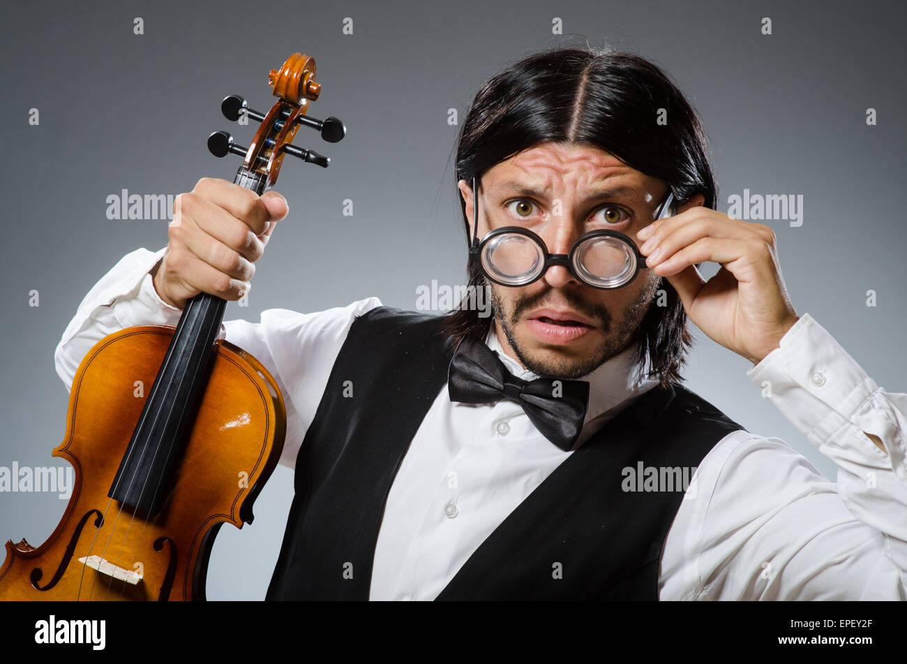 Funny fiddle violin player in musical concept Stock Photo - Alamy