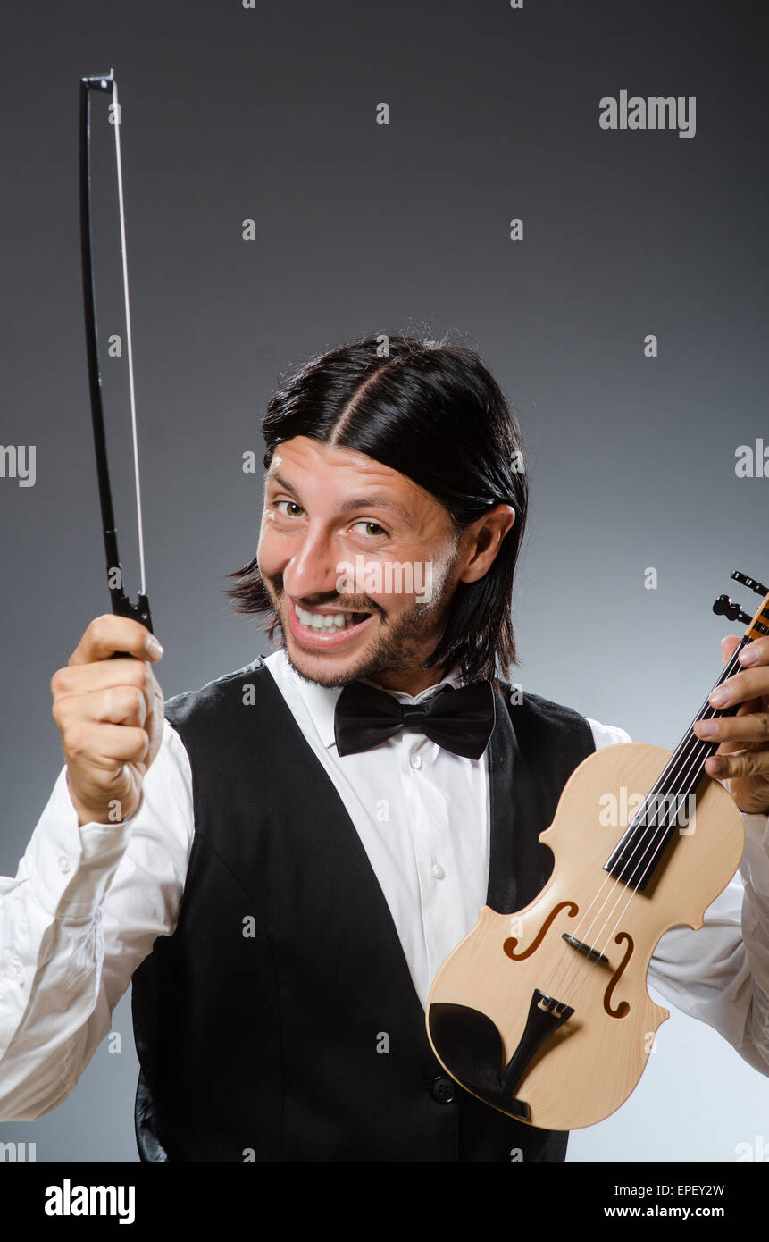 Funny fiddle violin player in musical concept Stock Photo - Alamy