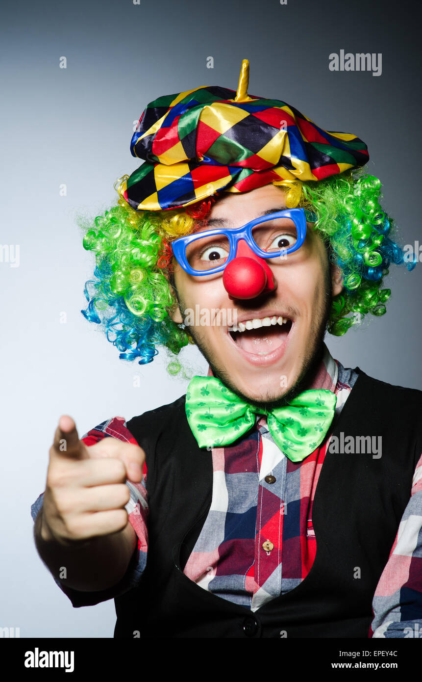 Funny clown against the dark background Stock Photo - Alamy