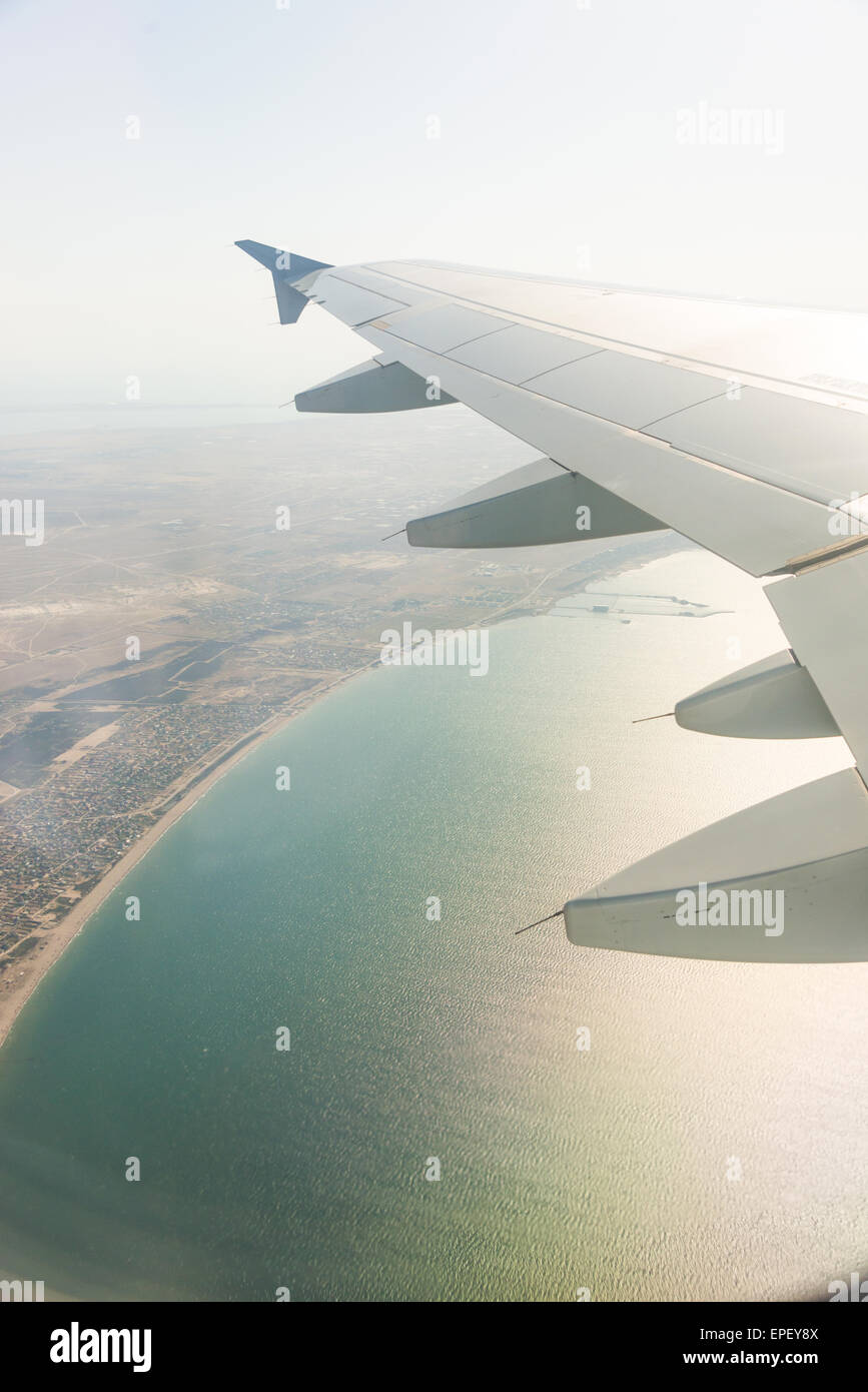 Airplane wing out of window Stock Photo - Alamy