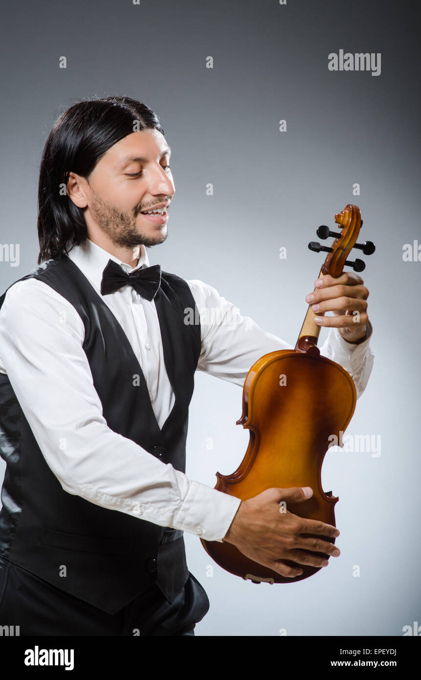 Funny fiddle violin player in musical concept Stock Photo - Alamy