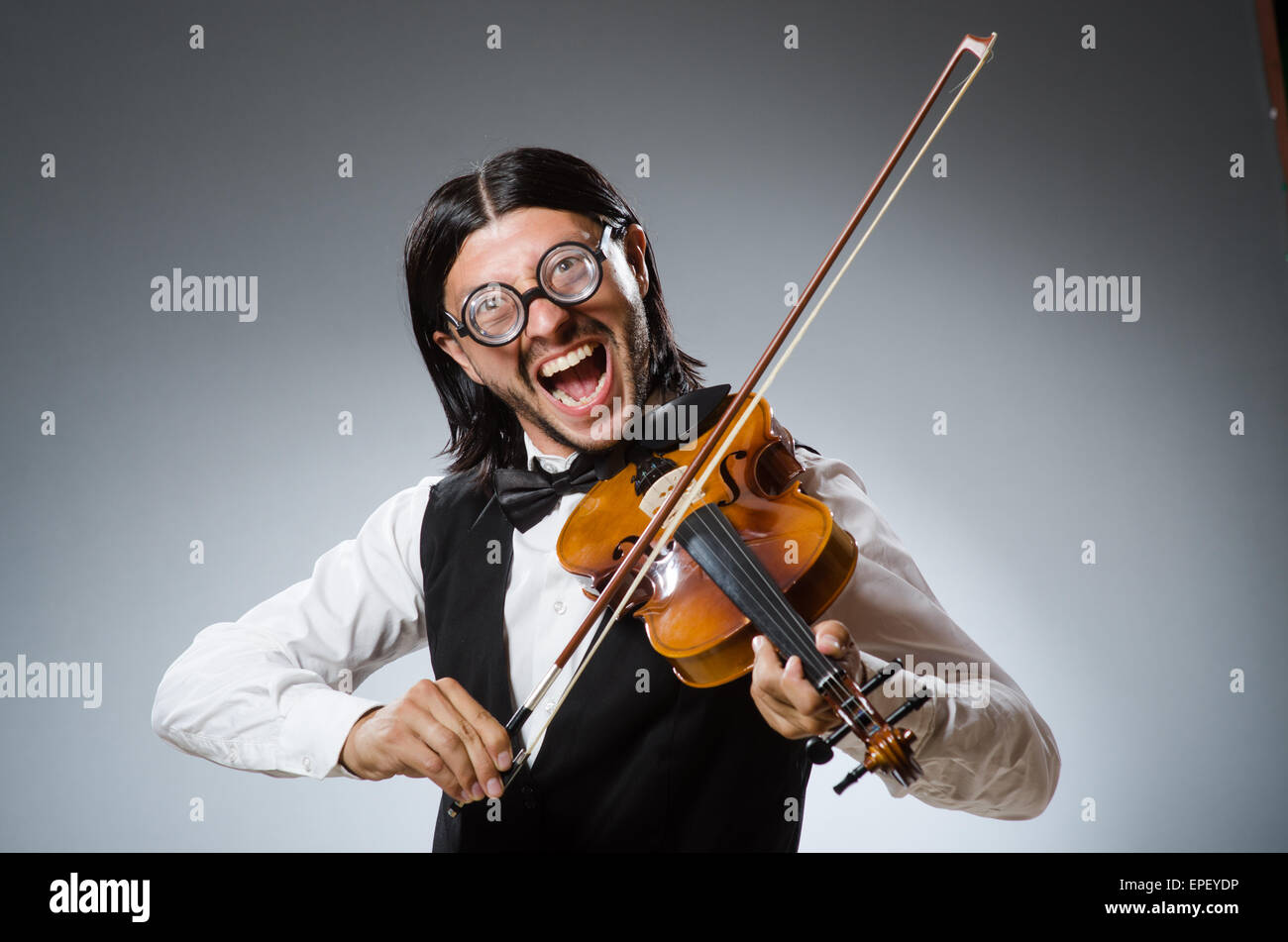 Funny fiddle violin player in musical concept Stock Photo - Alamy