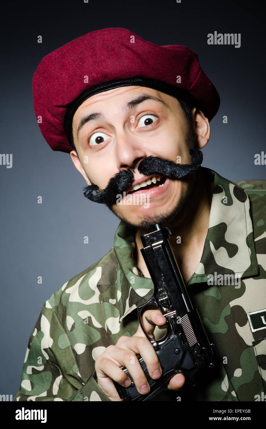 Funny soldier against the dark background Stock Photo - Alamy