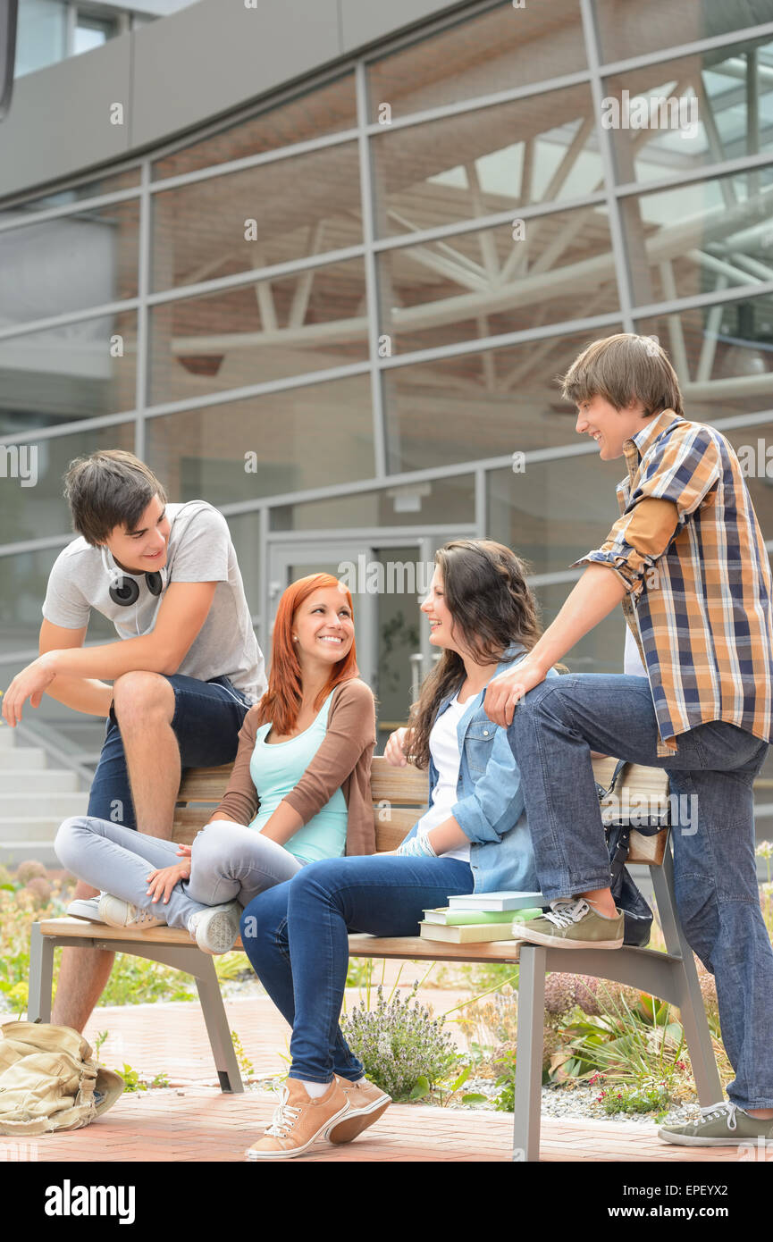 Students friends sitting bench front of university Stock Photo - Alamy