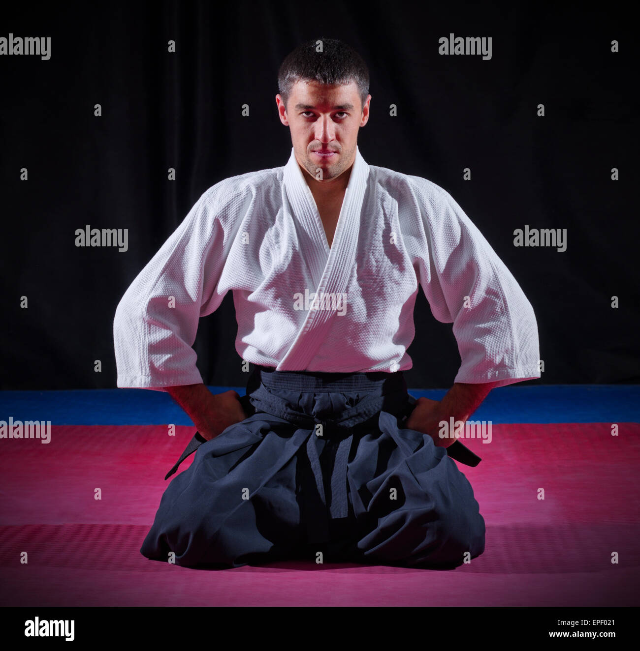 Aikido fighter on black background Stock Photo - Alamy