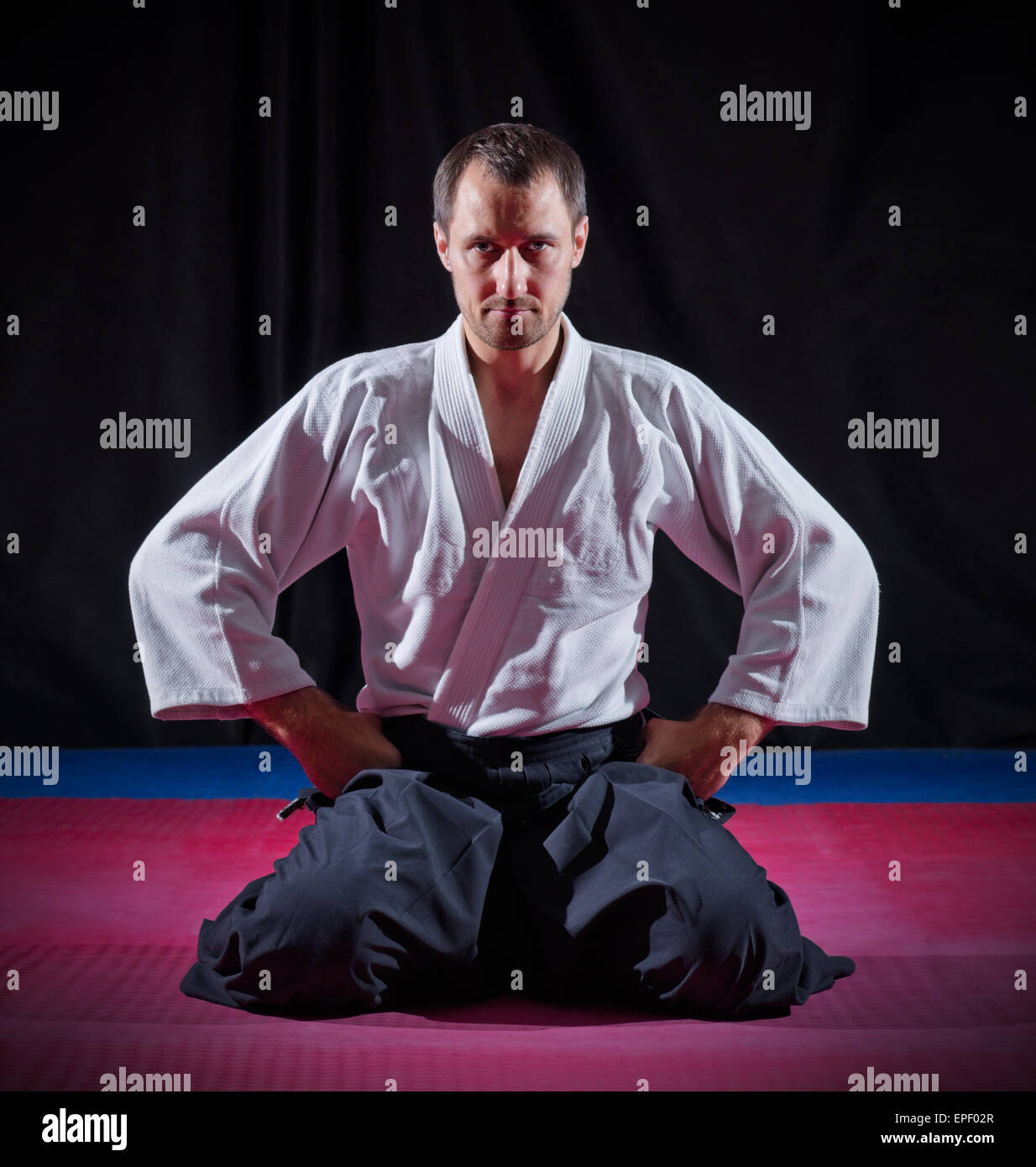 Aikido fighter on black background Stock Photo - Alamy