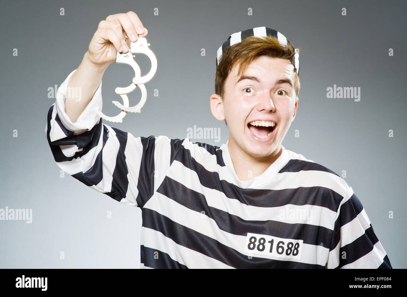 Funny prison inmate in concept Stock Photo - Alamy