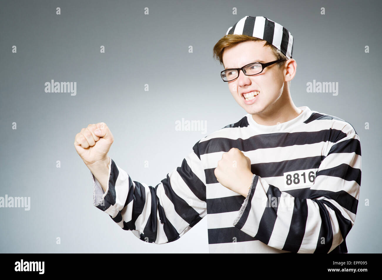 Funny prison inmate in concept Stock Photo - Alamy