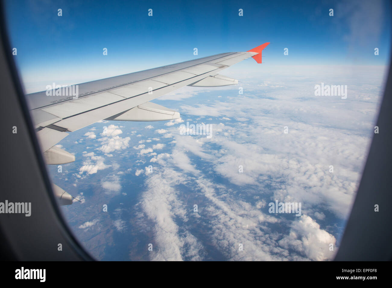 Airplane wing out of window Stock Photo - Alamy