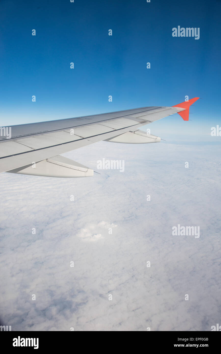 Airplane wing out of window Stock Photo - Alamy