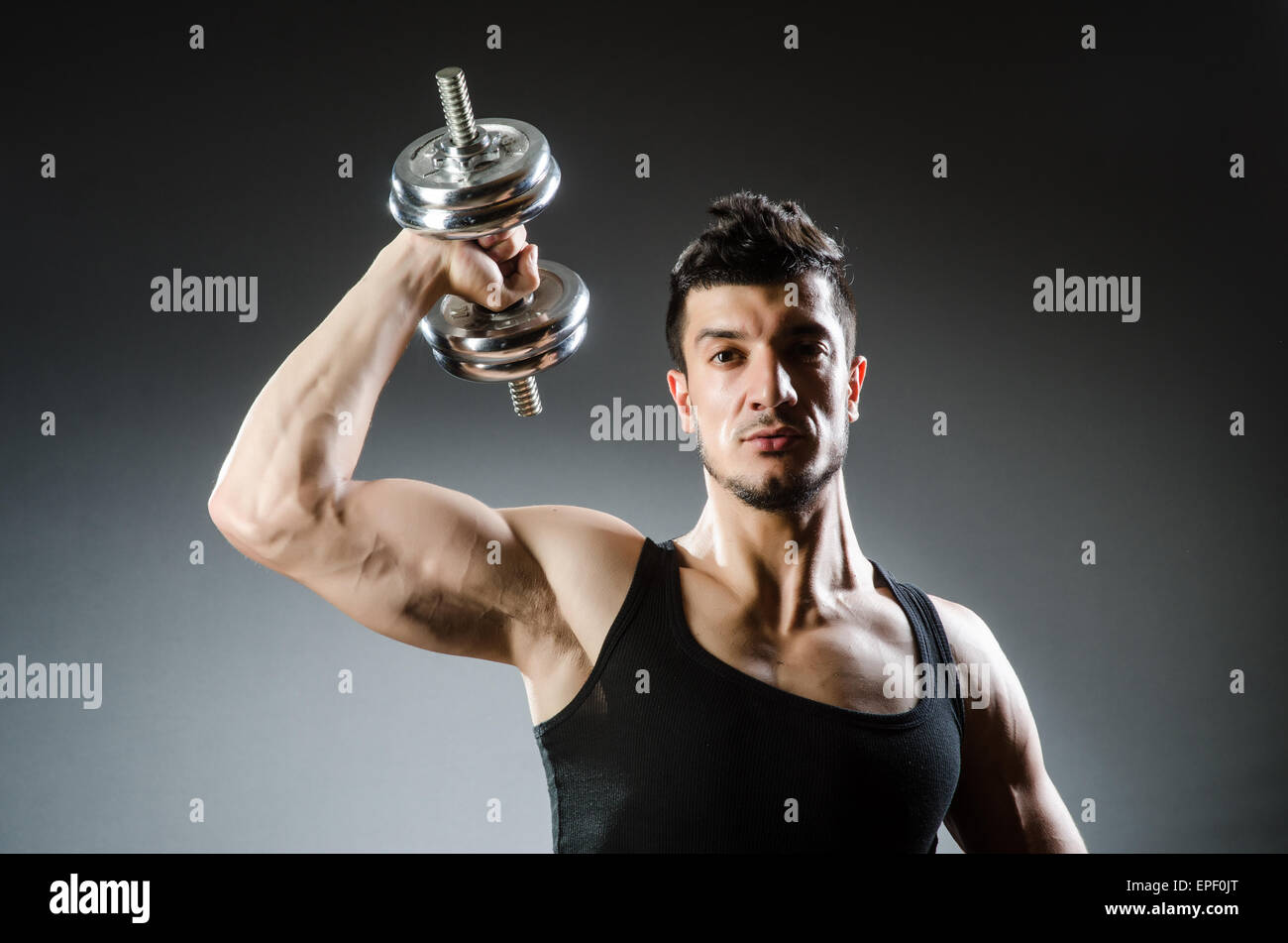 Muscular ripped bodybuilder with dumbbells Stock Photo - Alamy