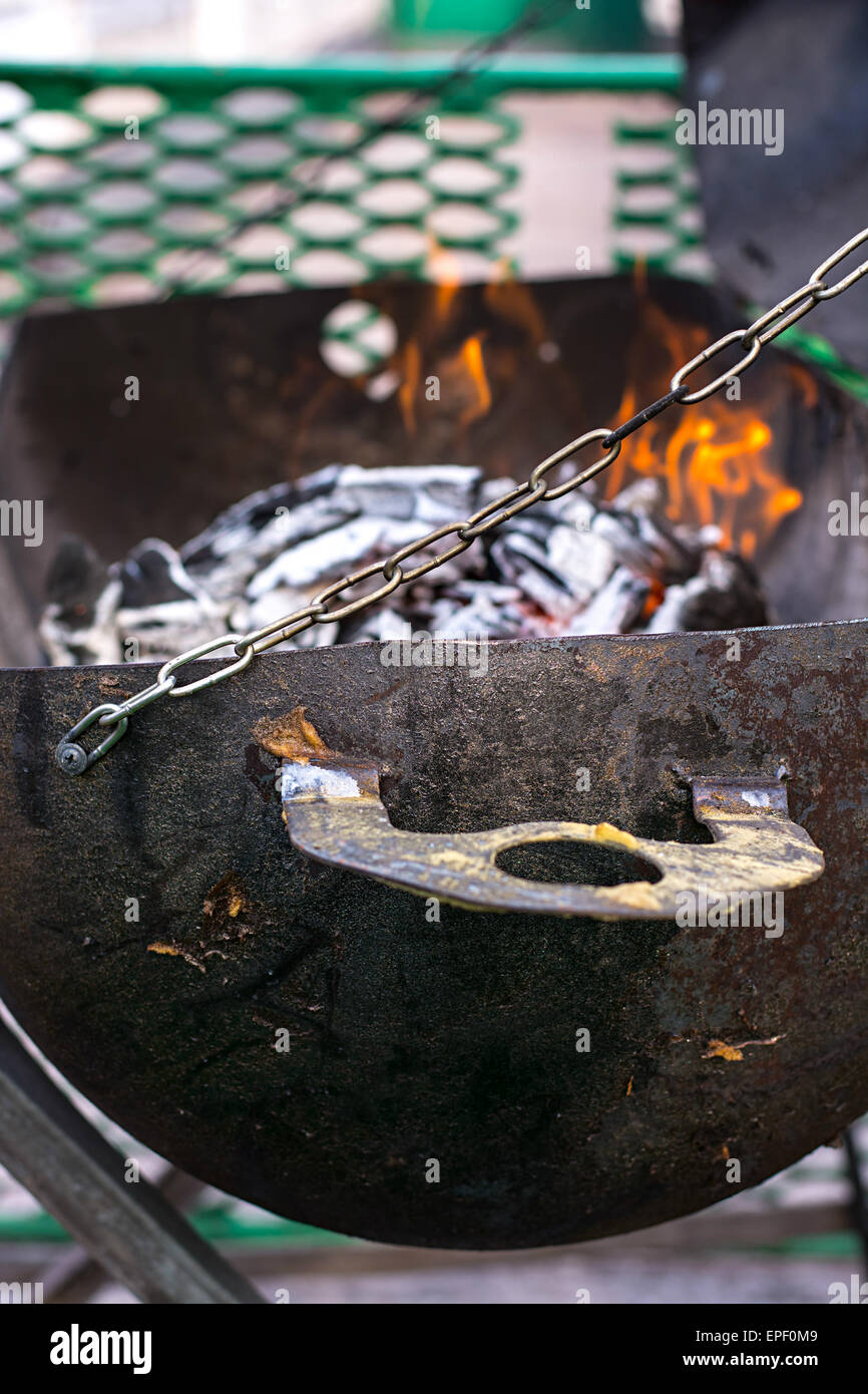 improvised brazier with burning wood in it.Selective focus Stock Photo ...