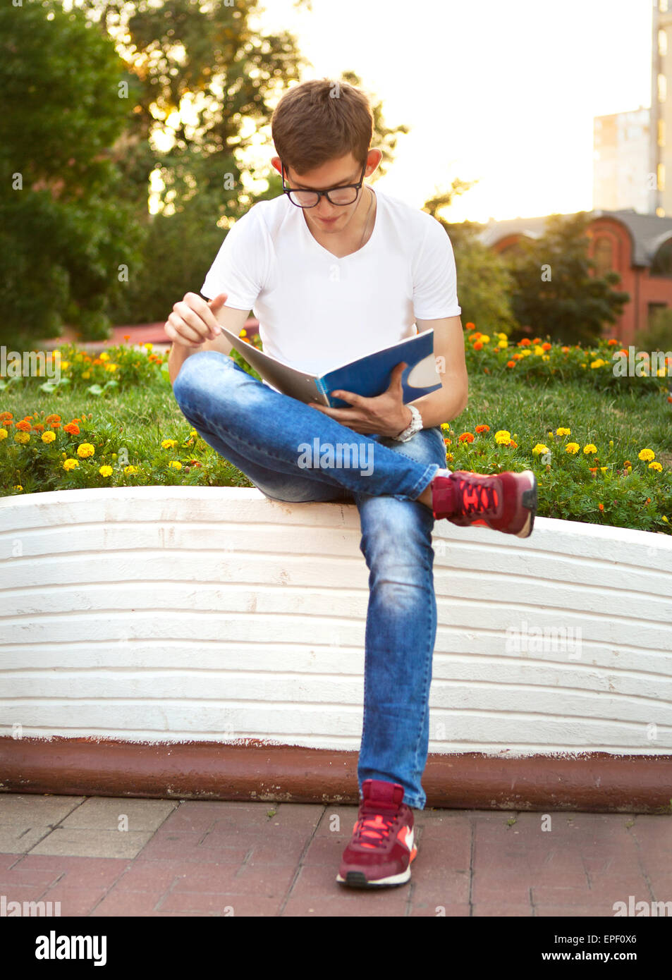 Student reading his notebook Stock Photo - Alamy