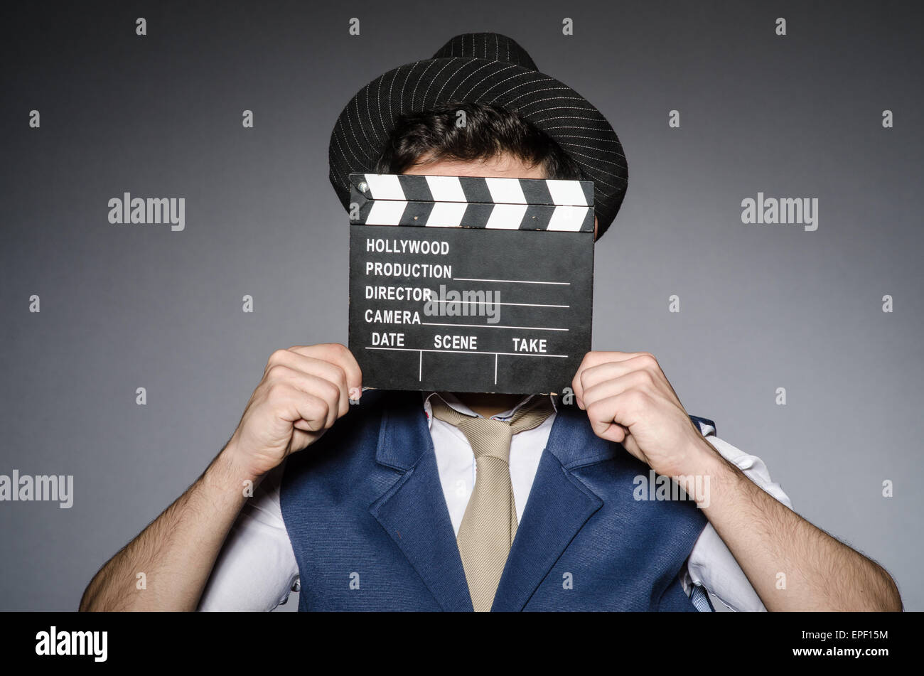 Funny man with movie clapper Stock Photo - Alamy