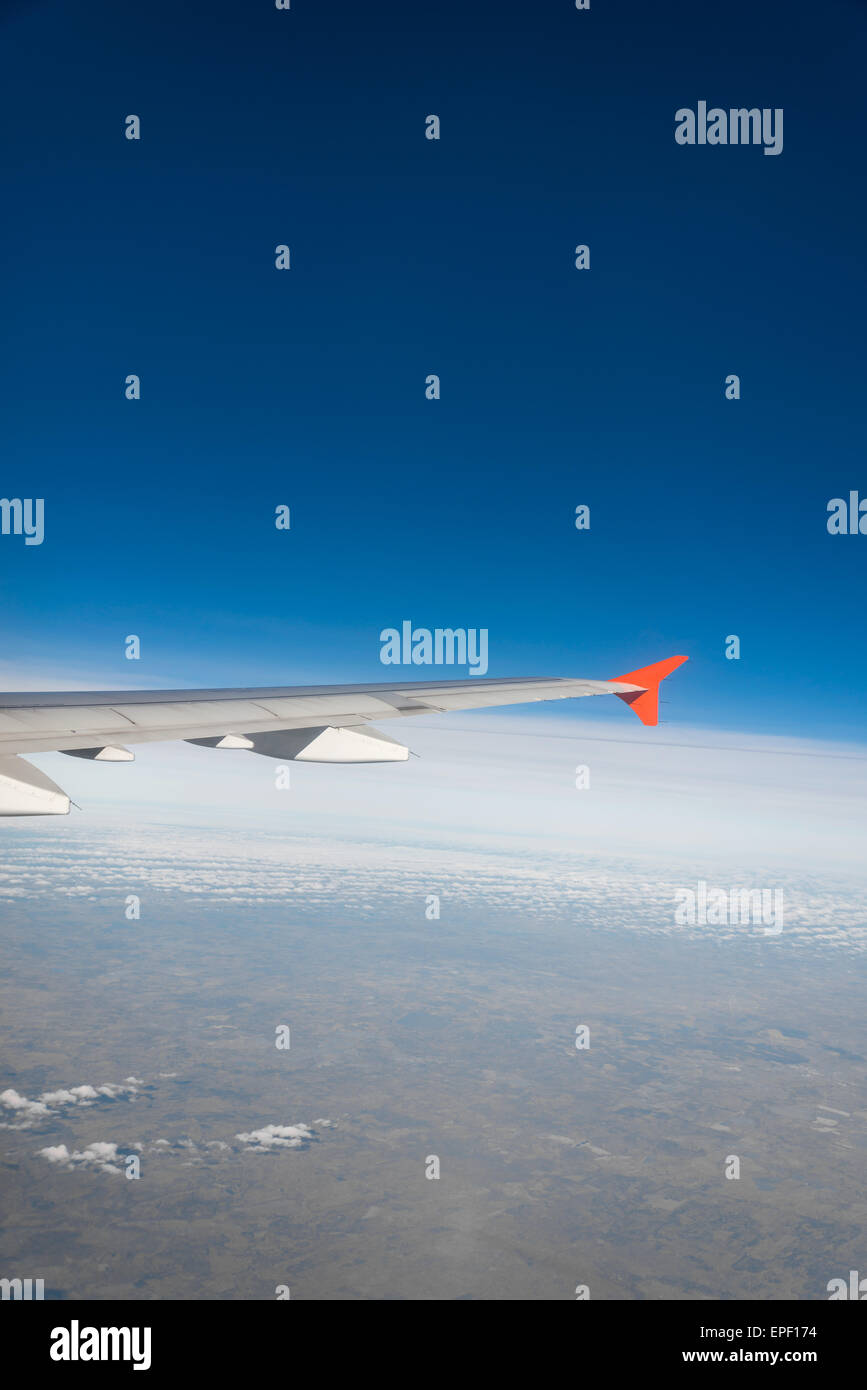 Airplane wing out of window Stock Photo - Alamy