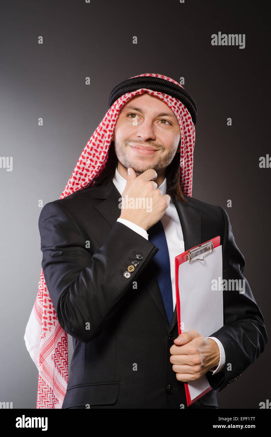 Arab man with paper binder Stock Photo - Alamy