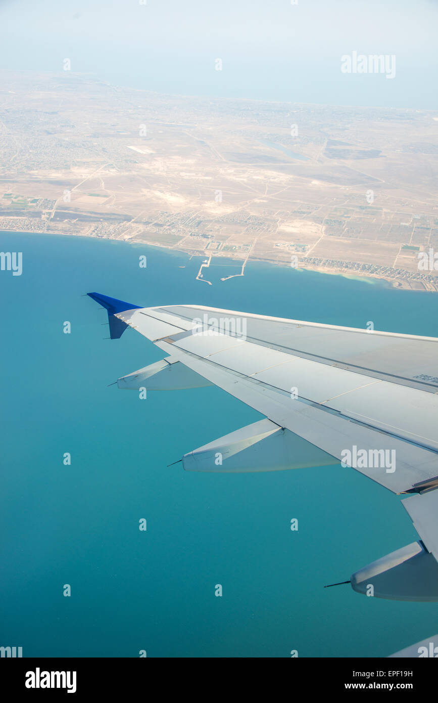 Airplane wing out of window Stock Photo - Alamy