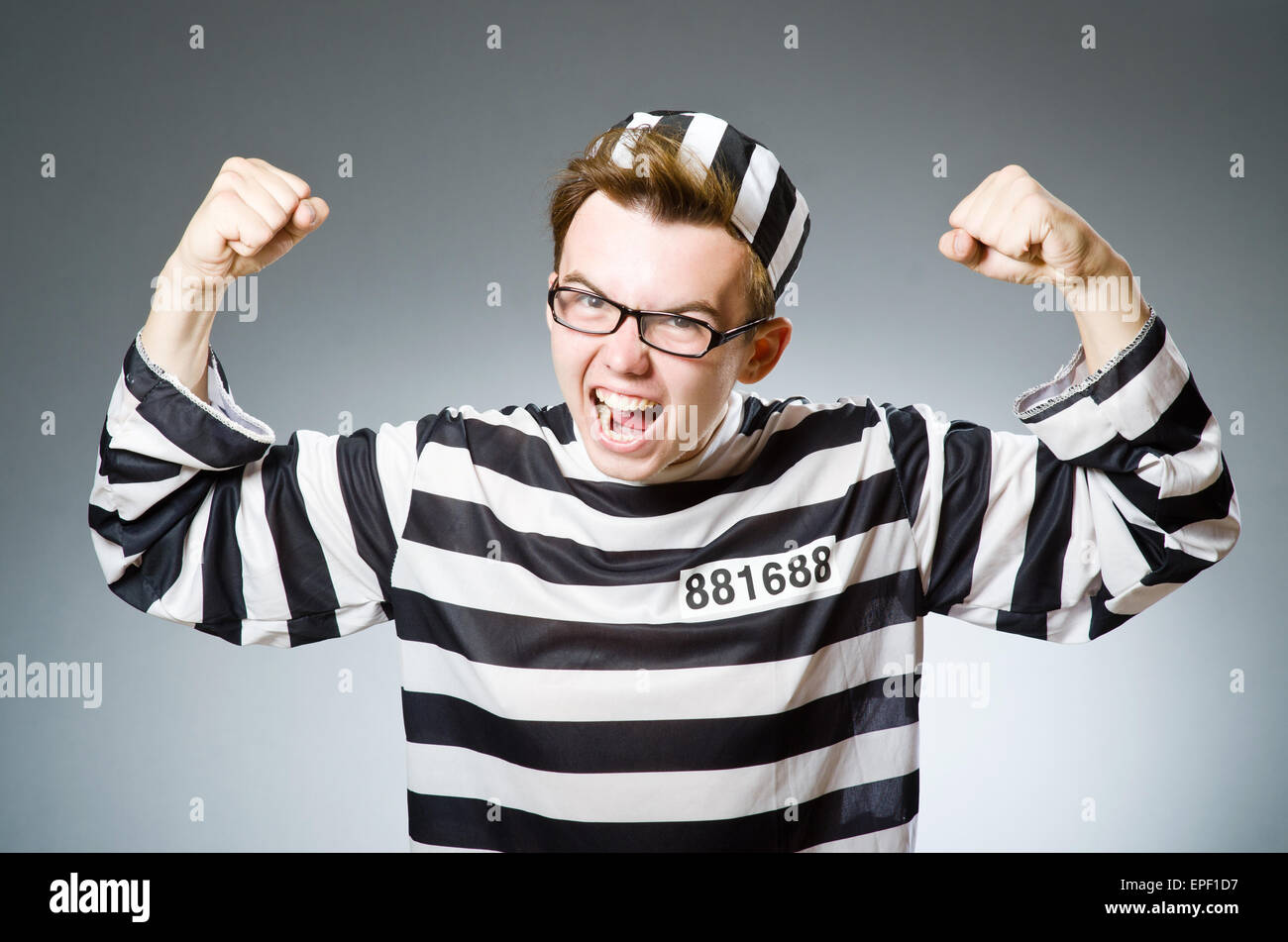 Funny prison inmate in concept Stock Photo - Alamy