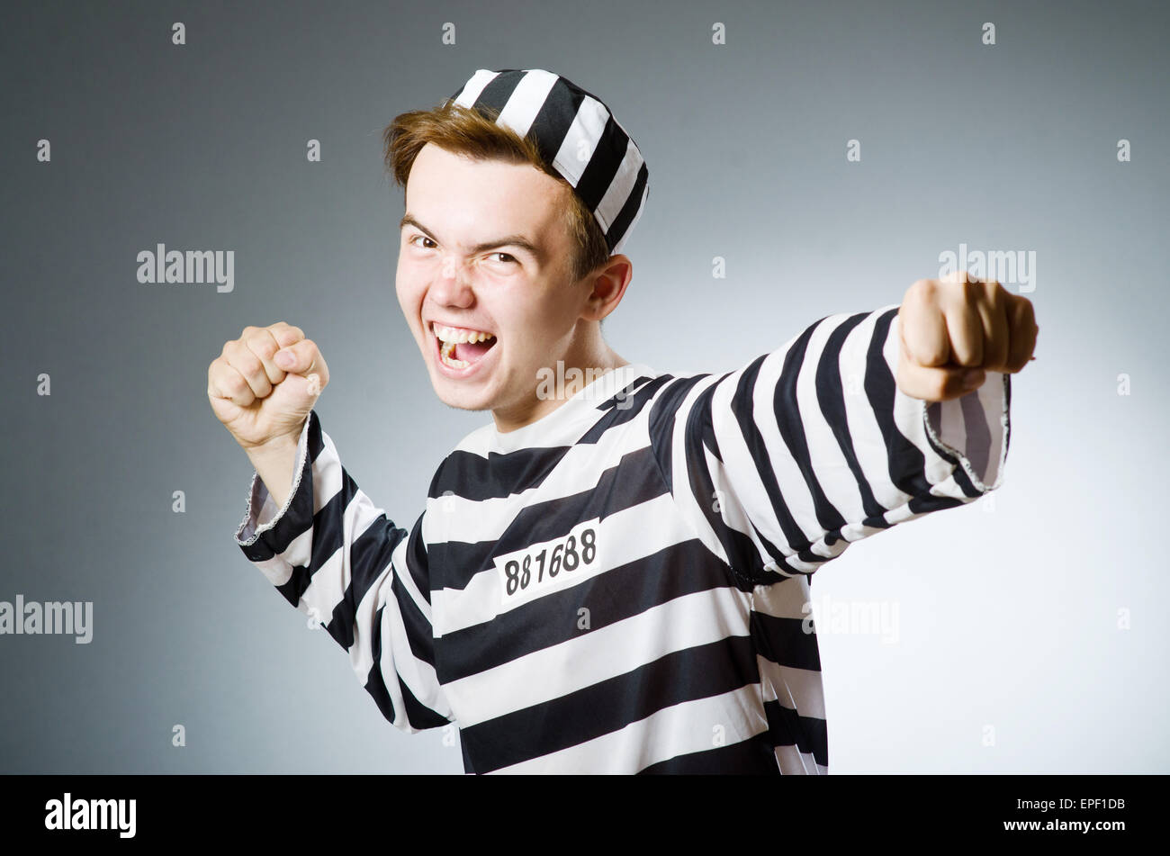 Funny prison inmate in concept Stock Photo - Alamy