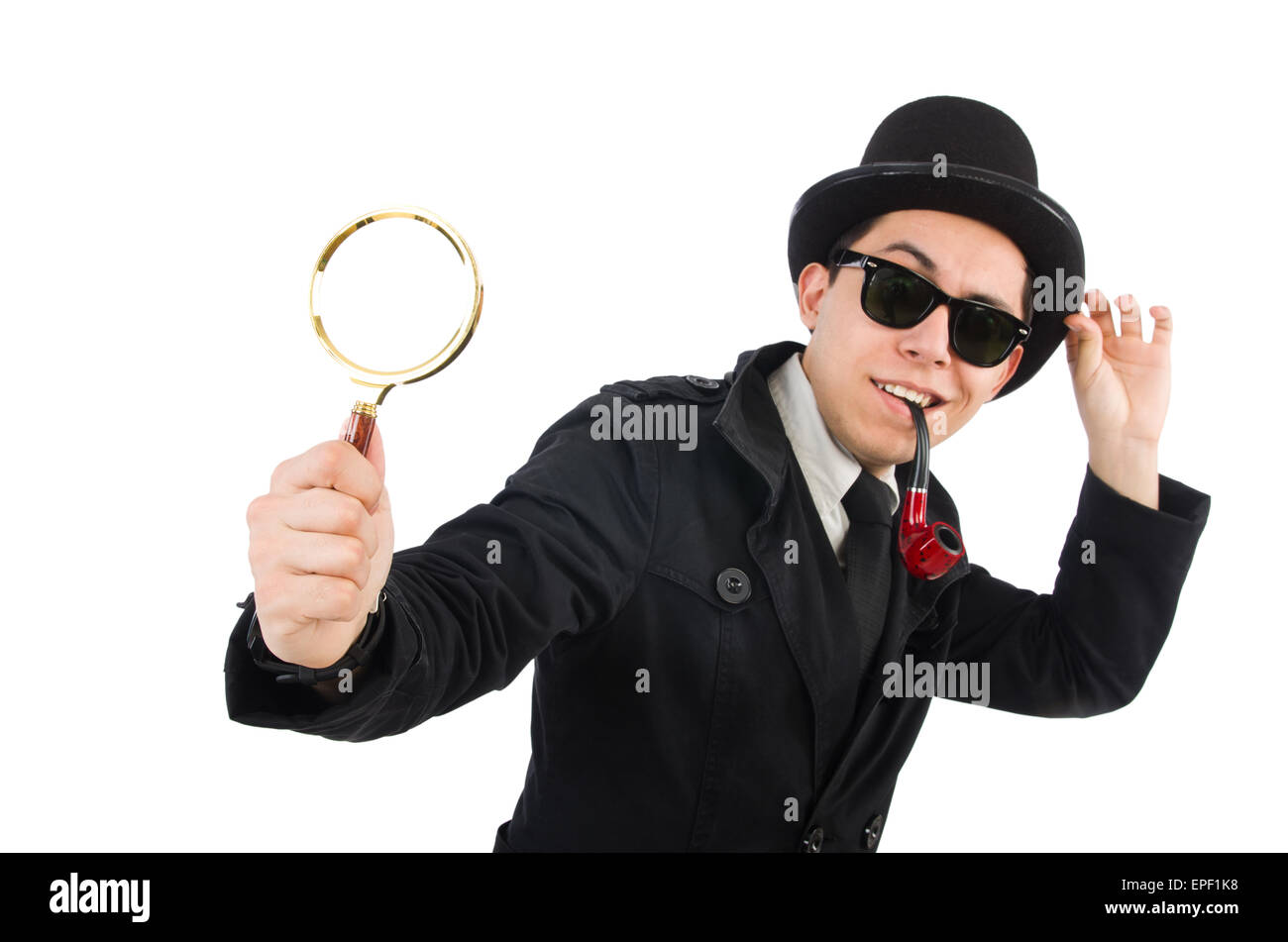 Young detective with pipe and magnifying glass Stock Photo - Alamy