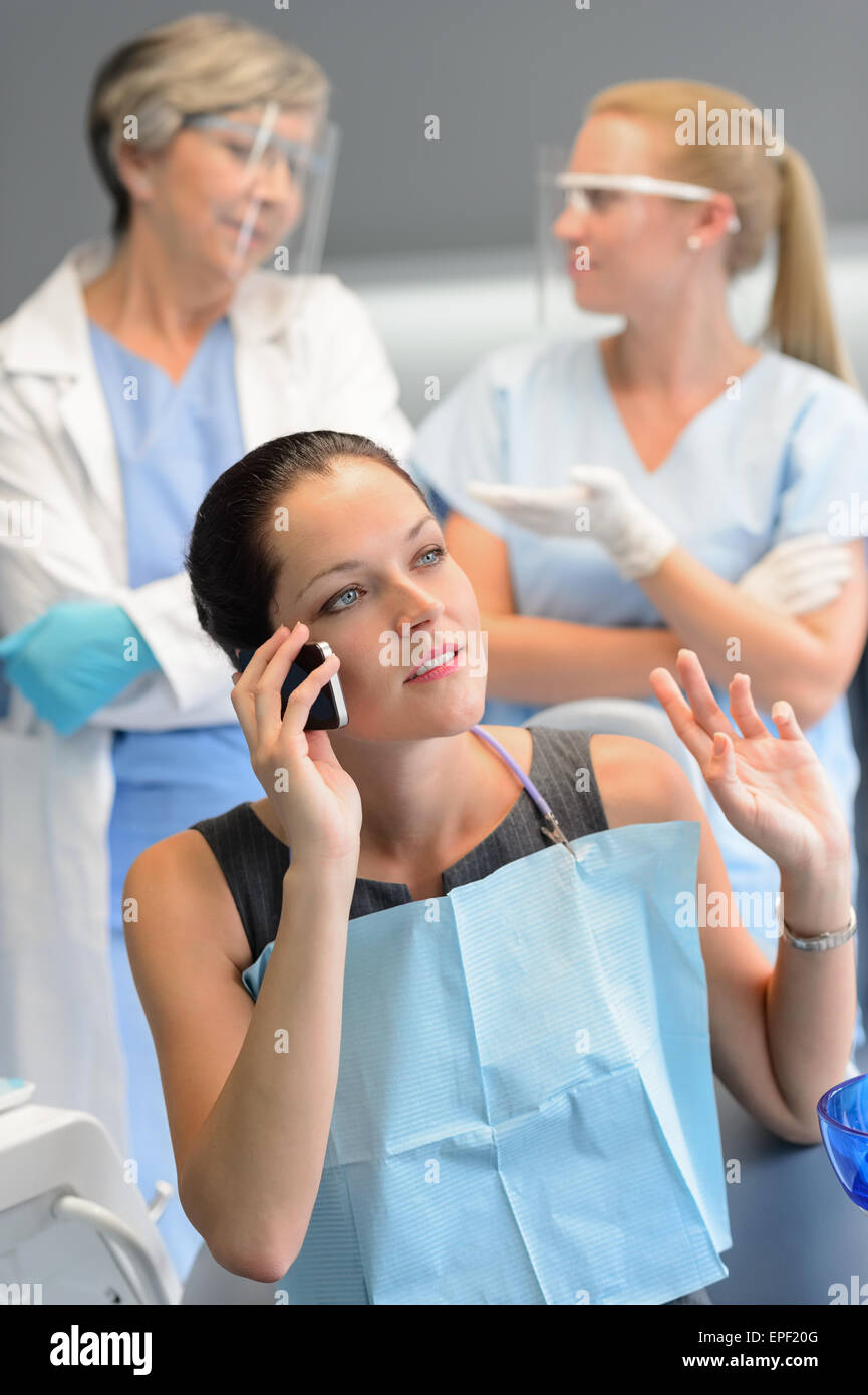 Busy woman patient calling at dentist office Stock Photo - Alamy