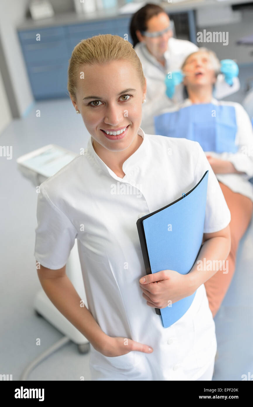 Dental assistant dentist checkup patient Stock Photo - Alamy