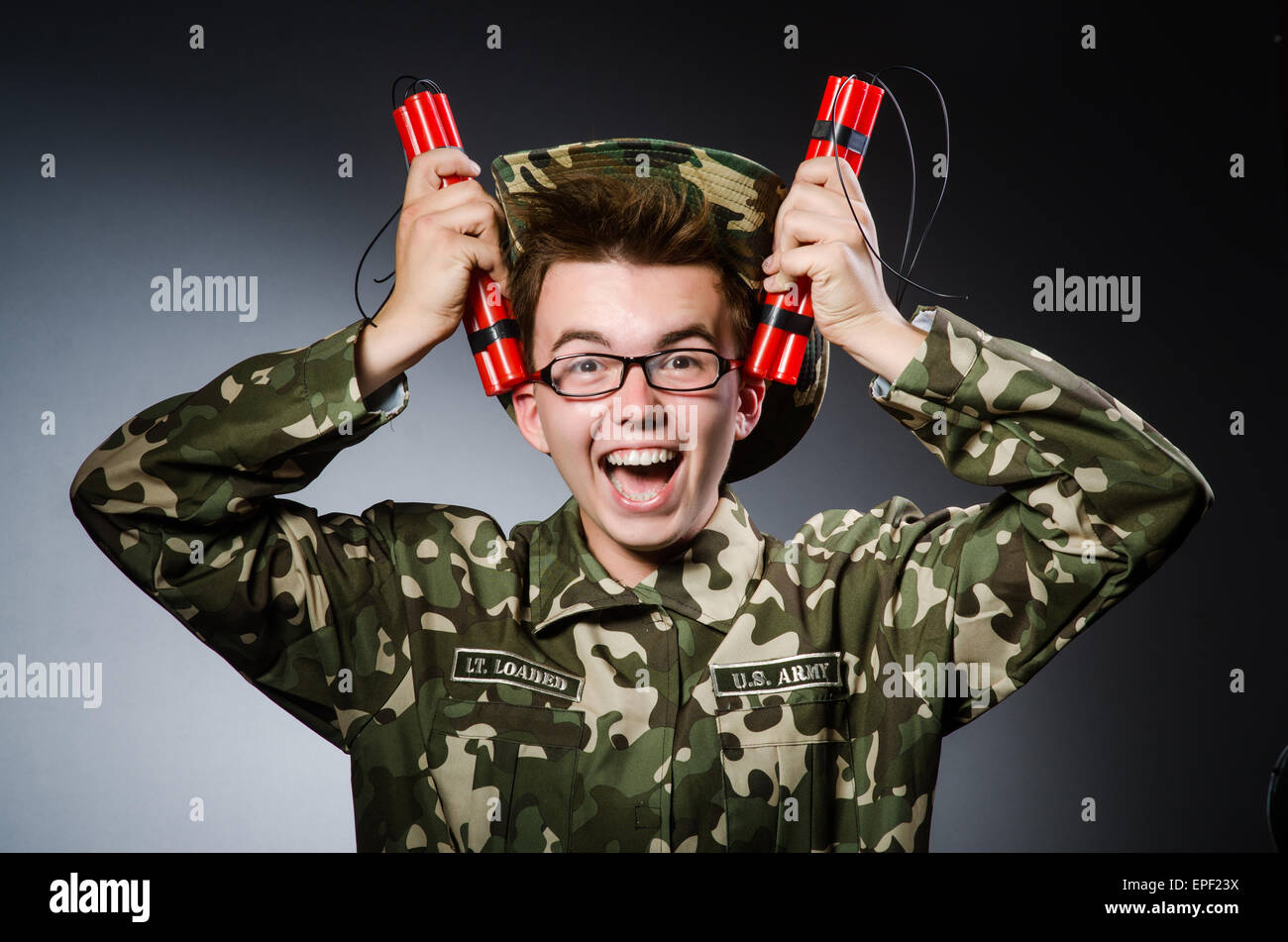Funny soldier with red dynamite Stock Photo - Alamy