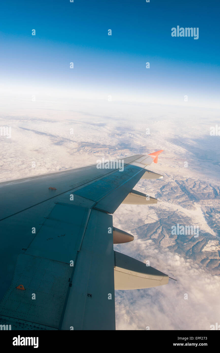 Airplane wing out of window Stock Photo - Alamy