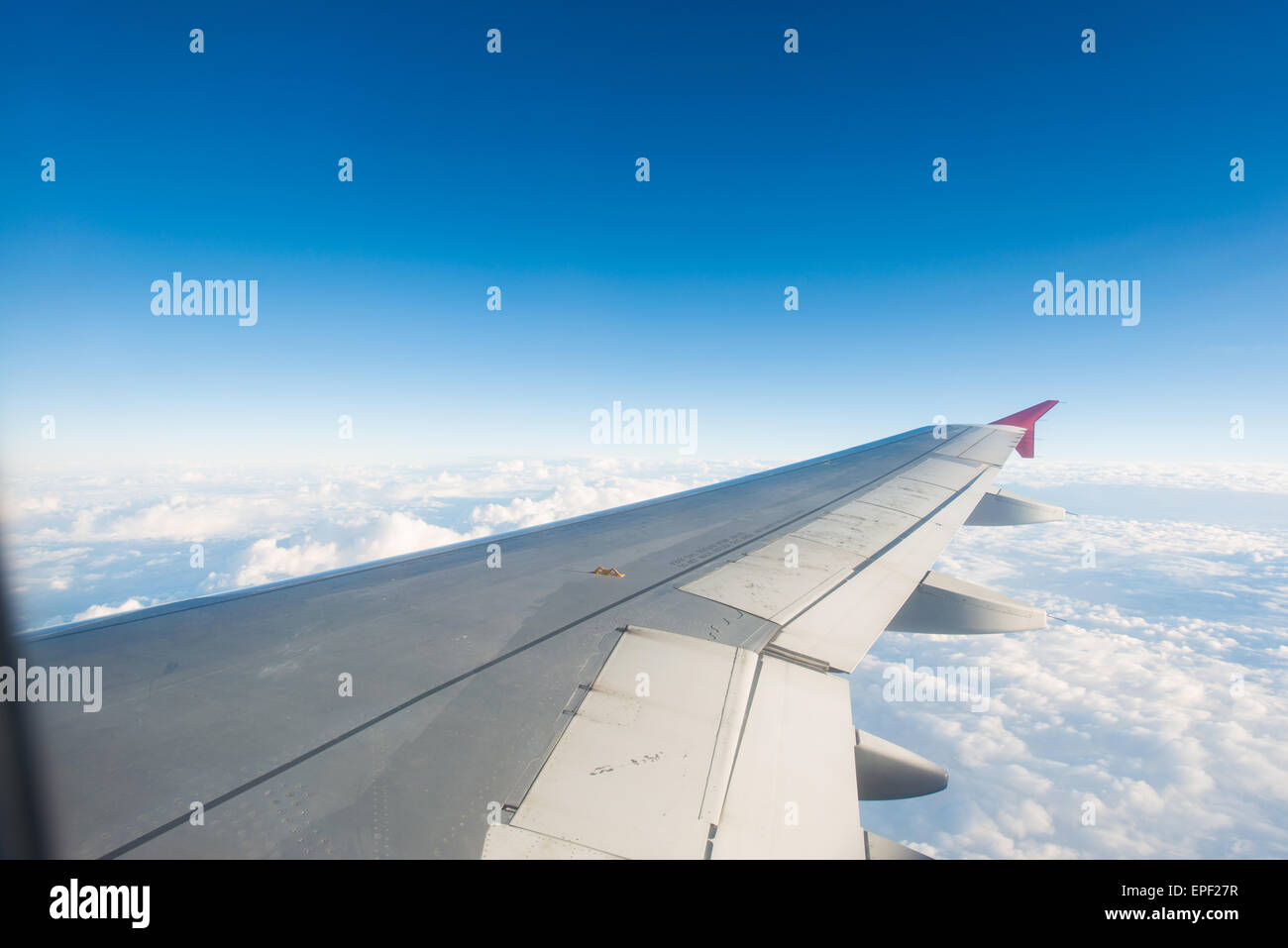 Airplane wing out of window Stock Photo - Alamy