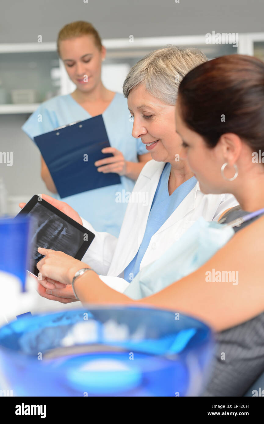 Dentist patient point xray tablet dental surgery Stock Photo - Alamy