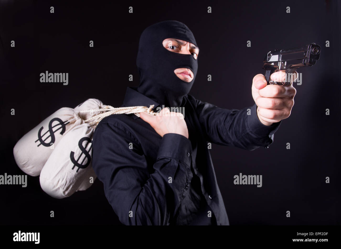 Man wearing balaclava with gun Stock Photo - Alamy