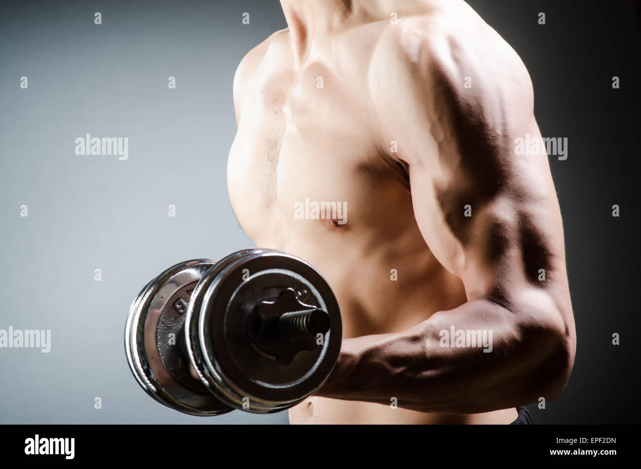 Muscular ripped bodybuilder with dumbbells Stock Photo - Alamy