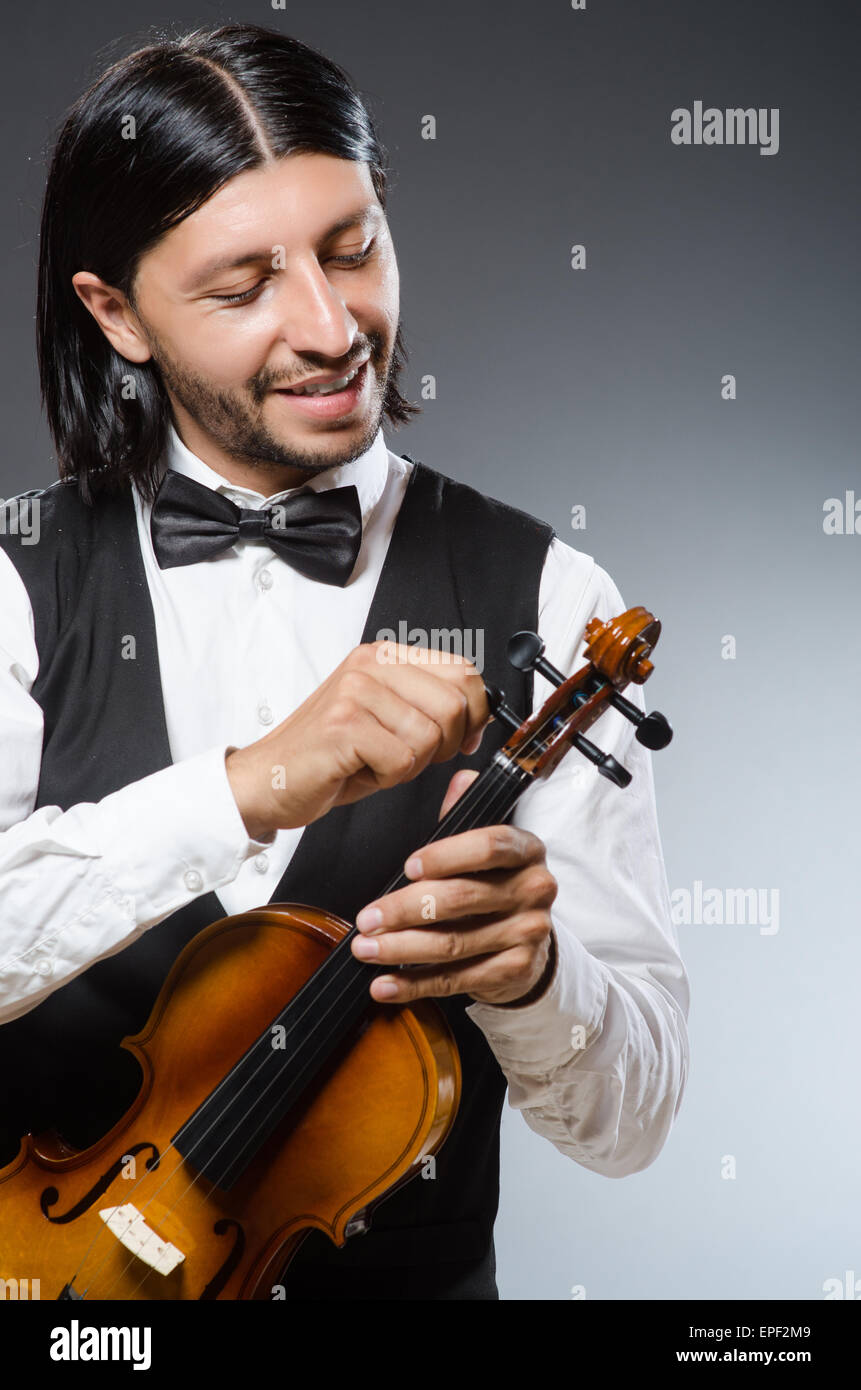 Funny fiddle violin player in musical concept Stock Photo - Alamy