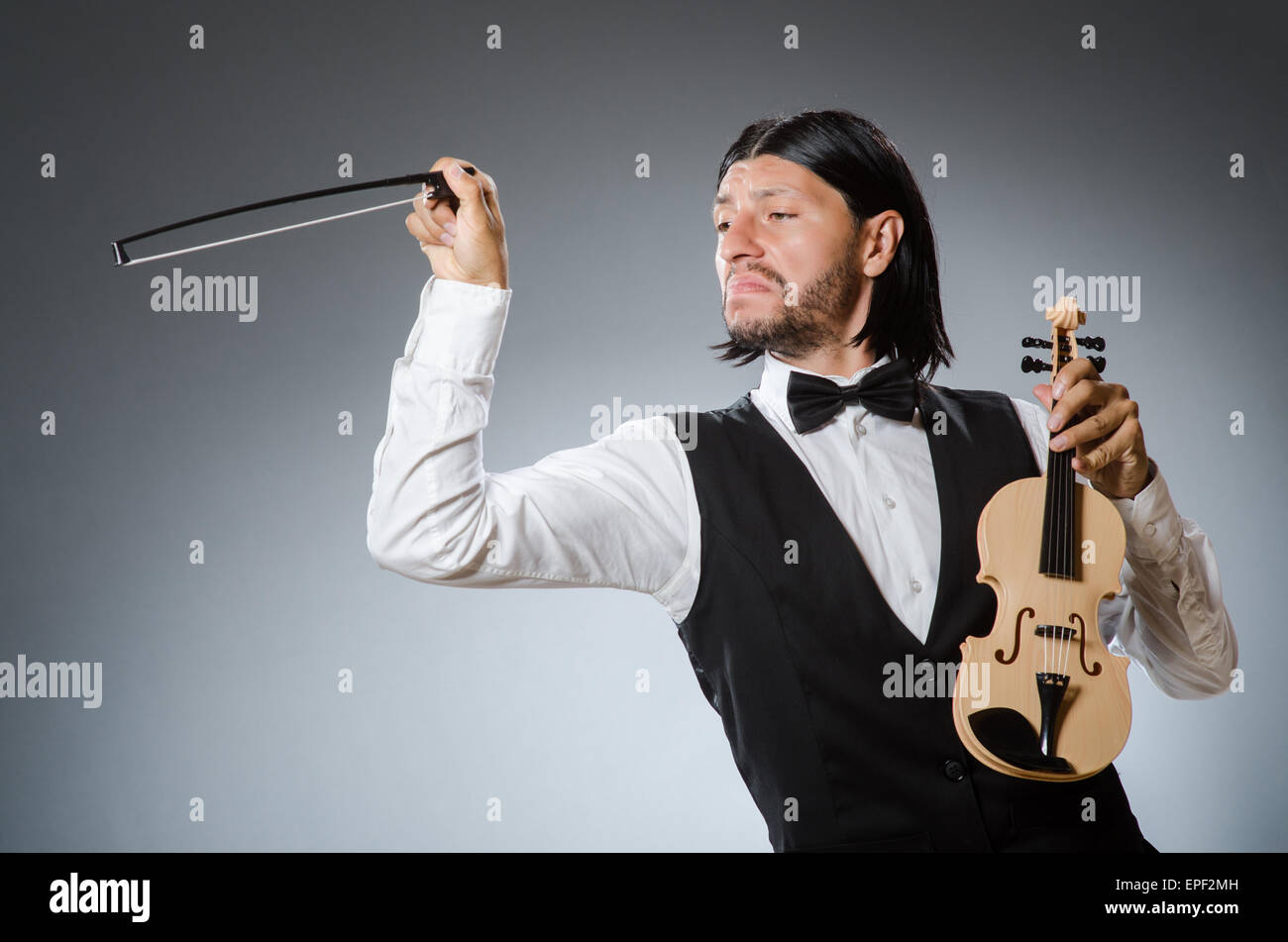 Funny fiddle violin player in musical concept Stock Photo - Alamy
