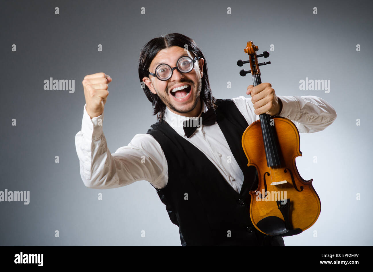 Funny fiddle violin player in musical concept Stock Photo - Alamy