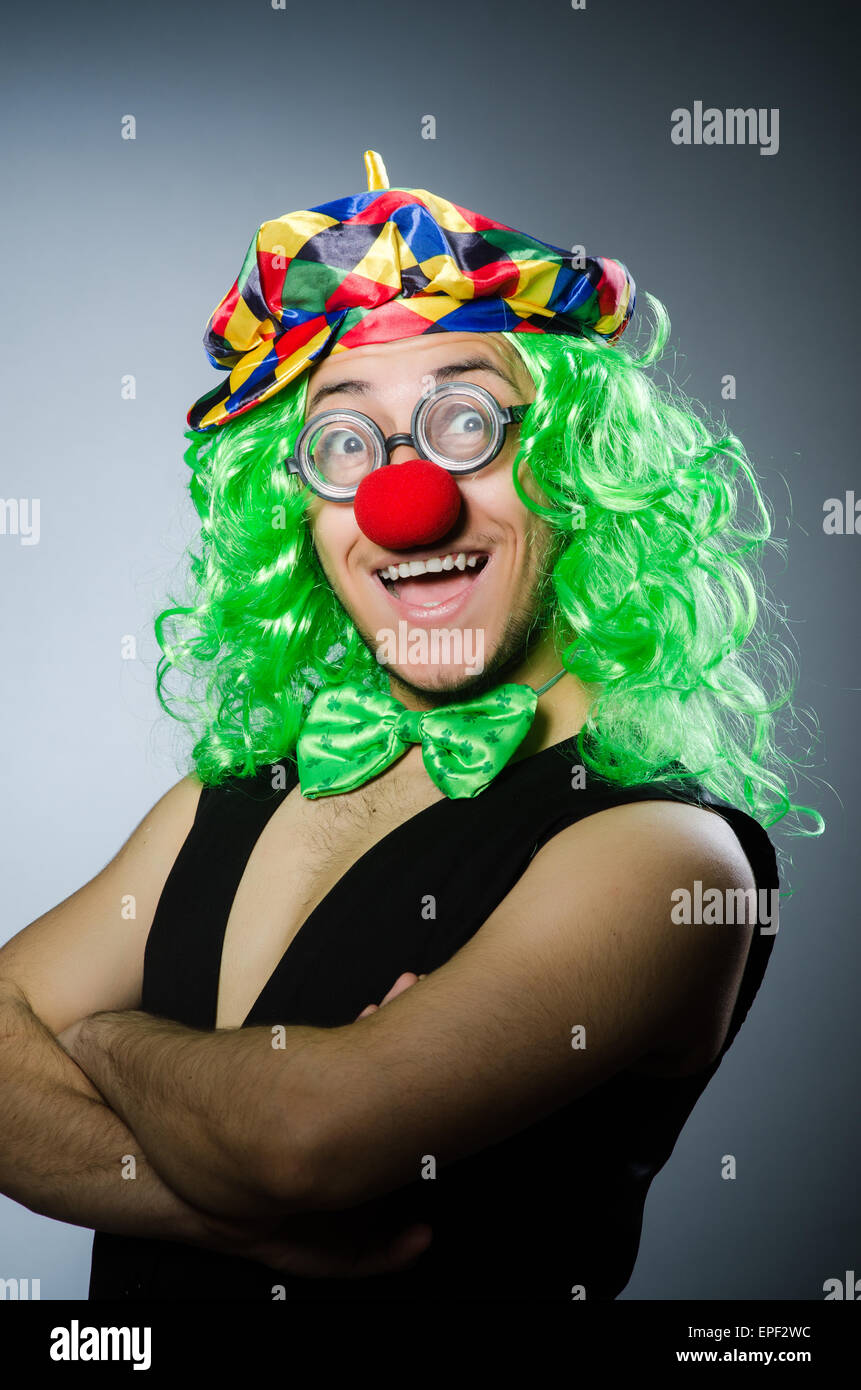 Funny clown against the dark background Stock Photo - Alamy