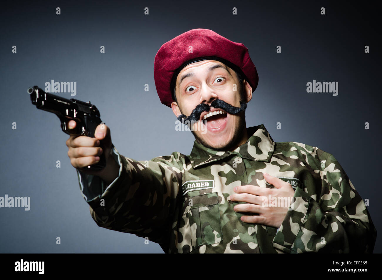 Funny soldier against the dark background Stock Photo - Alamy